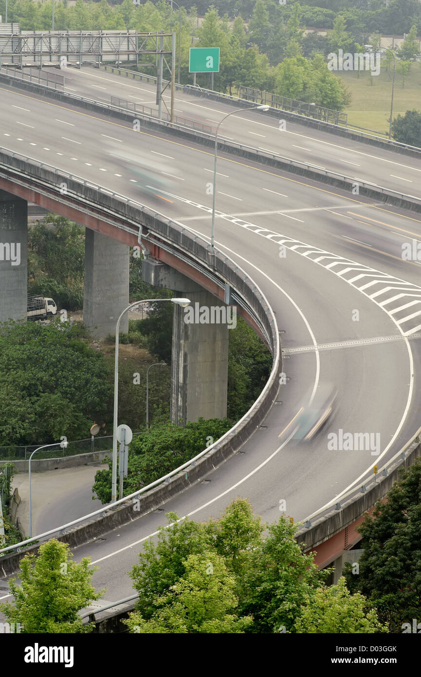 Interchange in highway with cars motion blurred in daytime in Taipei ...