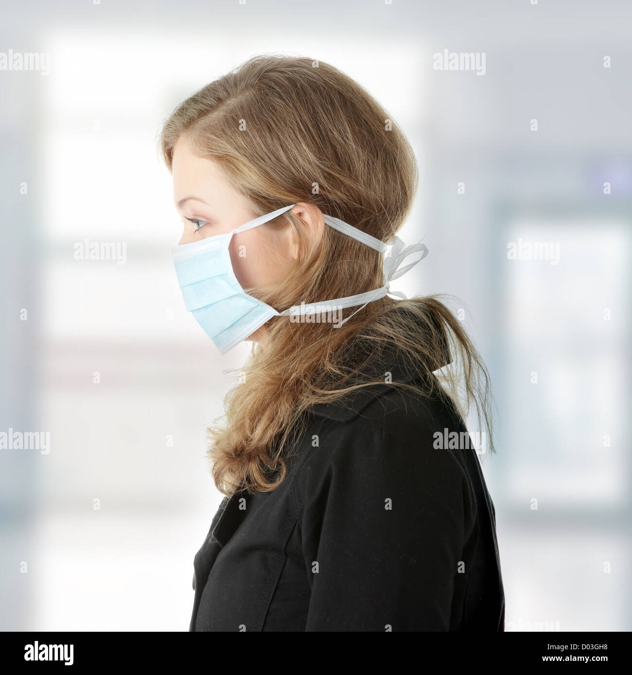 A model wearing a mask to prevent 'Swine Flu' infection. Isolated Stock ...