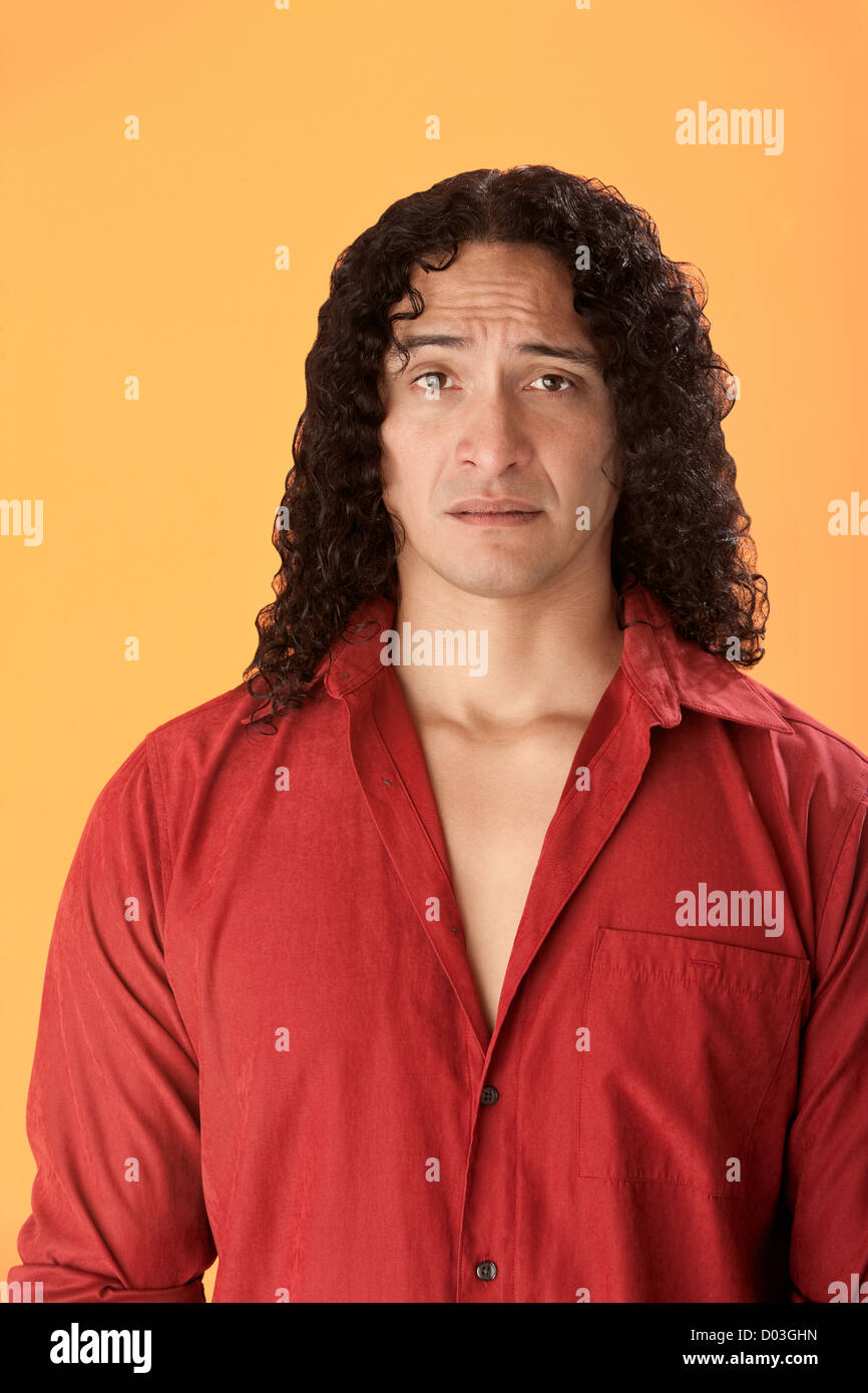 Handsome worried muscular Native American on an orange background Stock ...