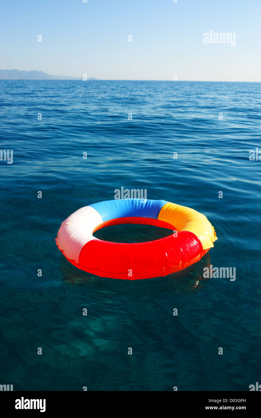 swim ring floating on beautiful blue water Stock Photo - Alamy