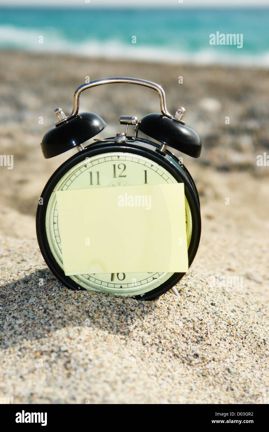 a closeup of an old clock on a beach Stock Photo - Alamy