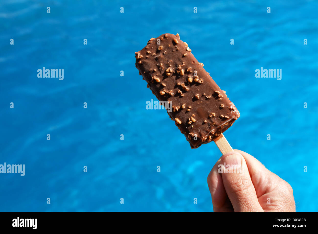 popsicle against a swimming pool on a hot day Stock Photo - Alamy