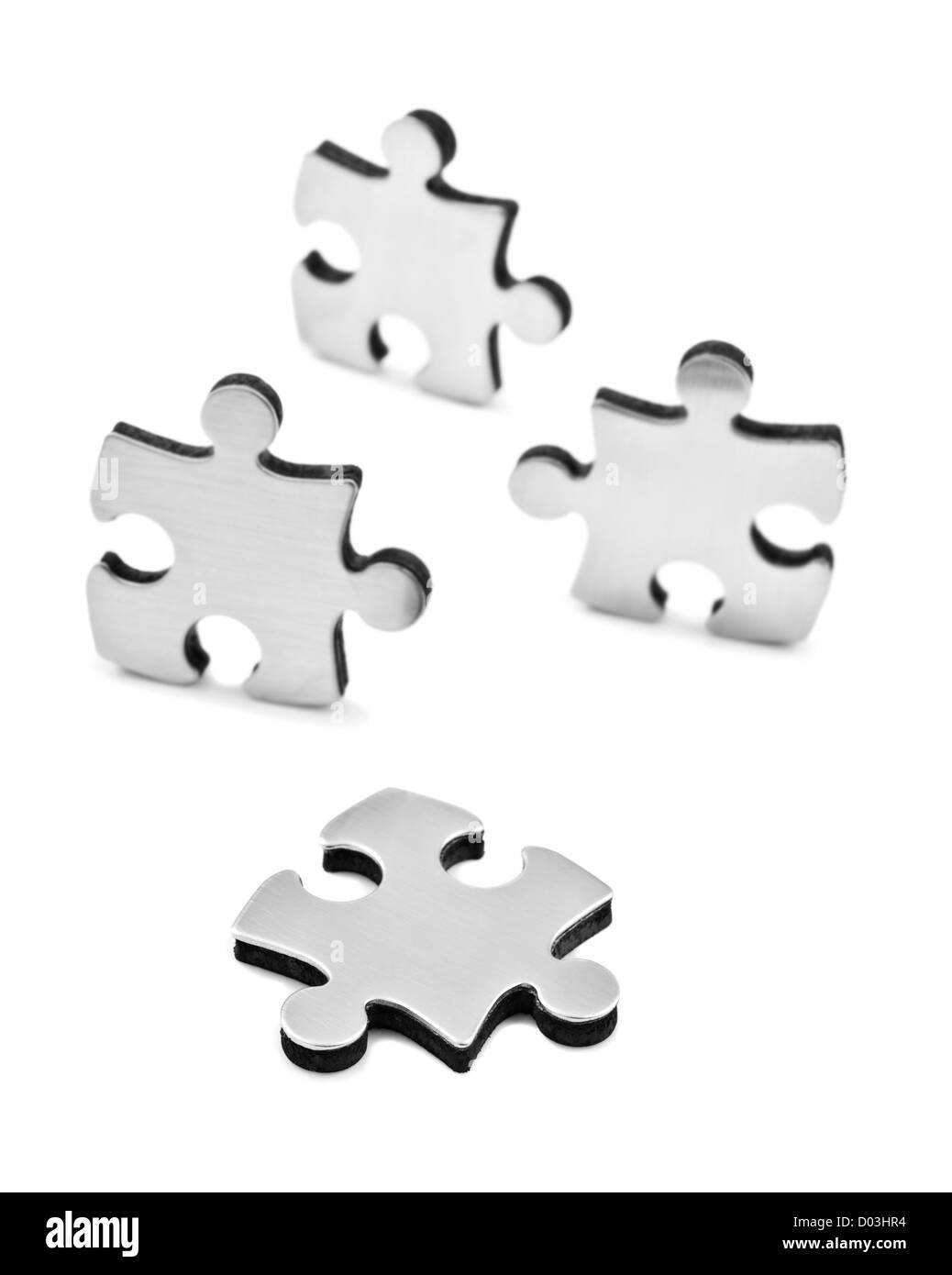 Stainless steel puzzle pieces on white background with space for text ...
