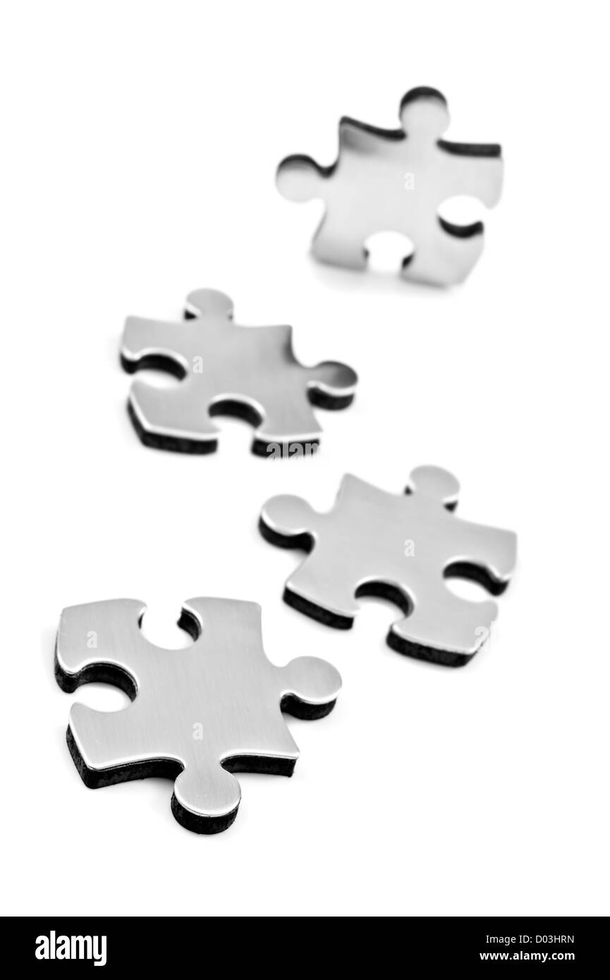 Stainless steel puzzle pieces on white background with space for text ...