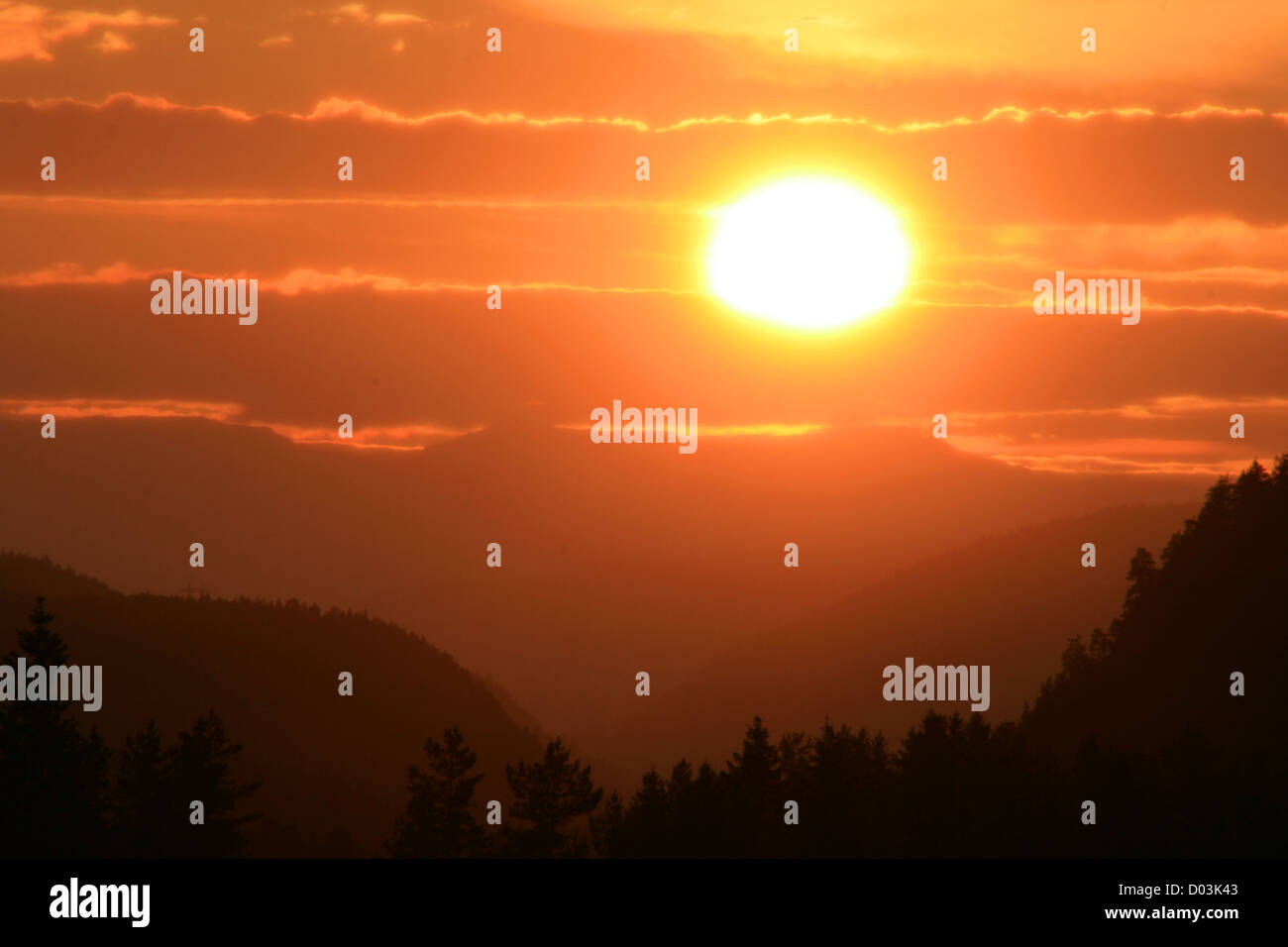 Red sun and clouds Stock Photo - Alamy