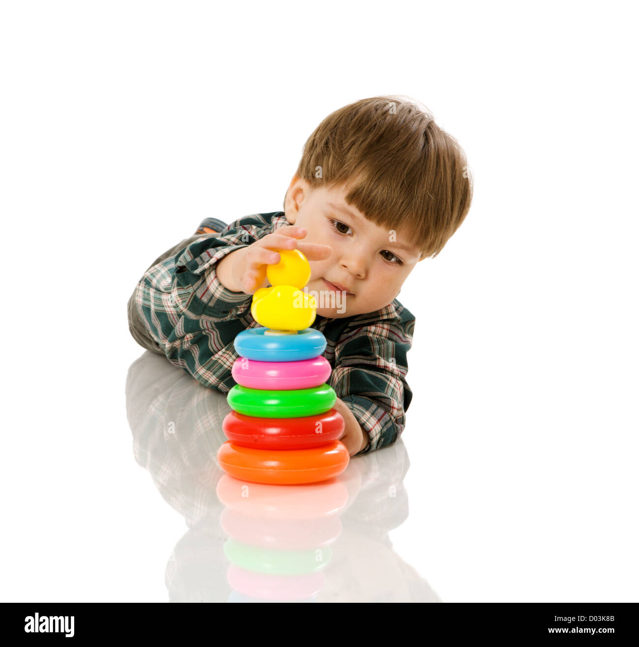 boy playing with colorful pyramid toy isolated on white Stock Photo - Alamy