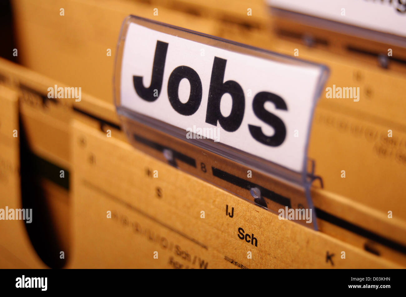 jobs or job concept with business folder in office showing earnings ...