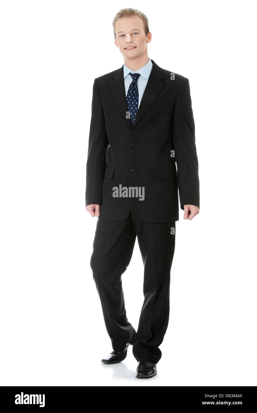 Full length portrait of a handsome business man standing against white ...