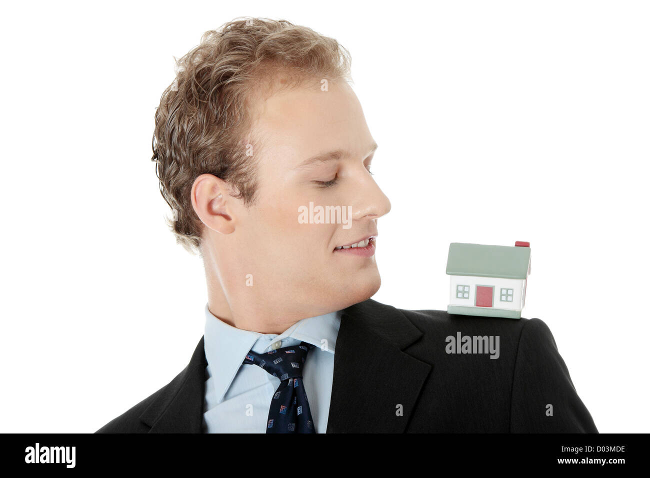 Young business man with house model - real estate concept. Isolated on ...