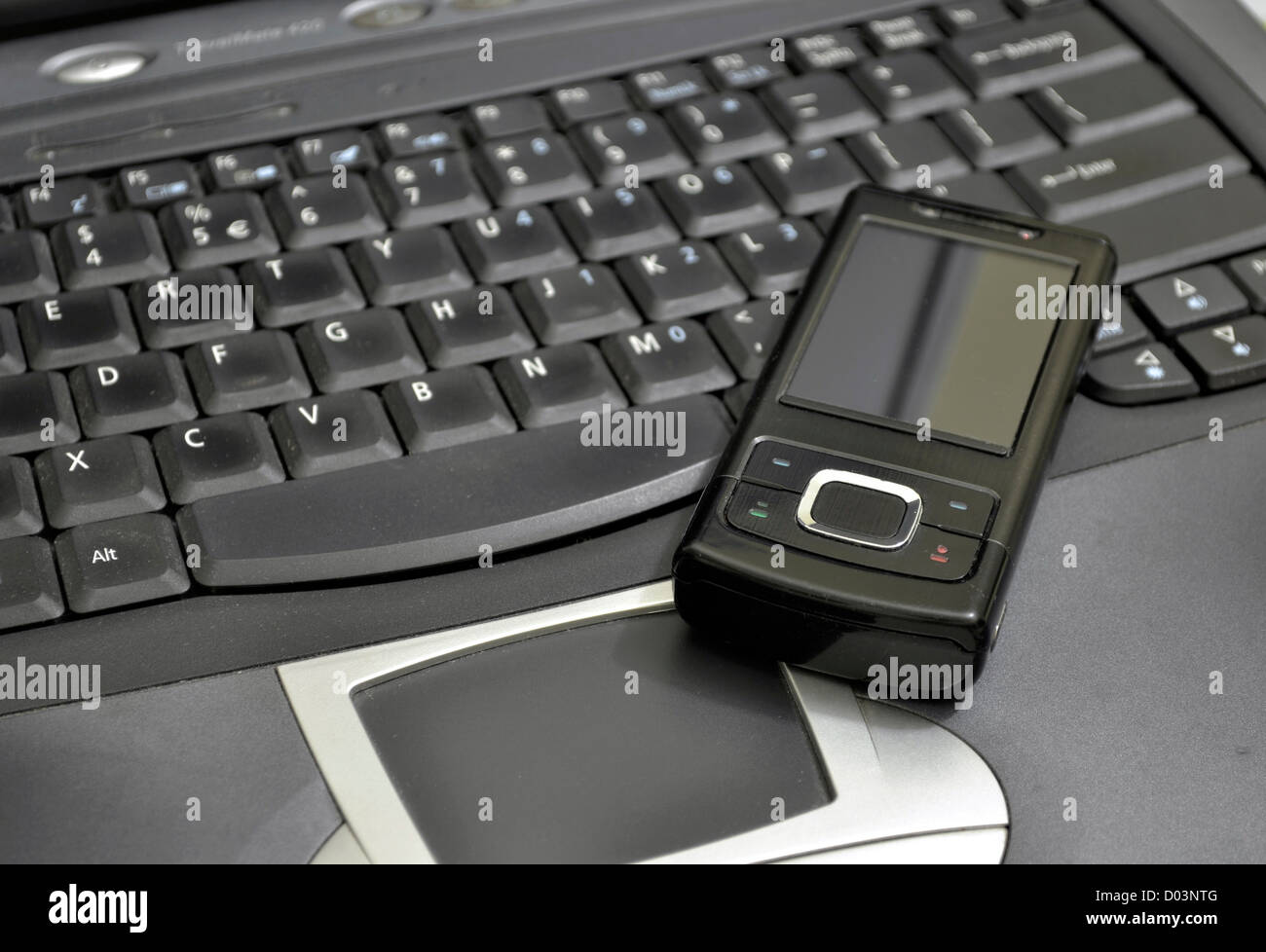 A cell phone and a Laptop Stock Photo - Alamy