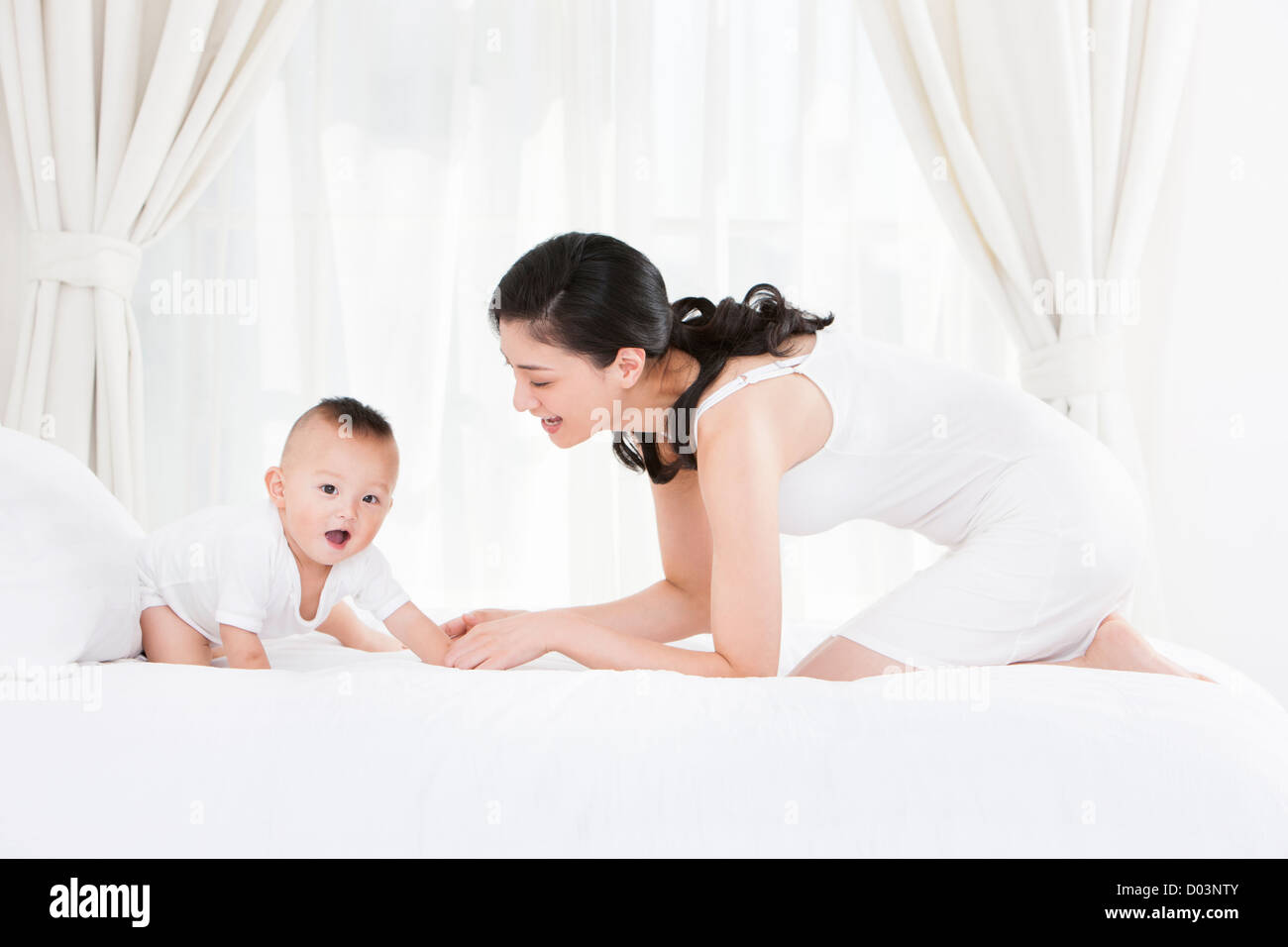 Mother and baby having a sweet time Stock Photo - Alamy