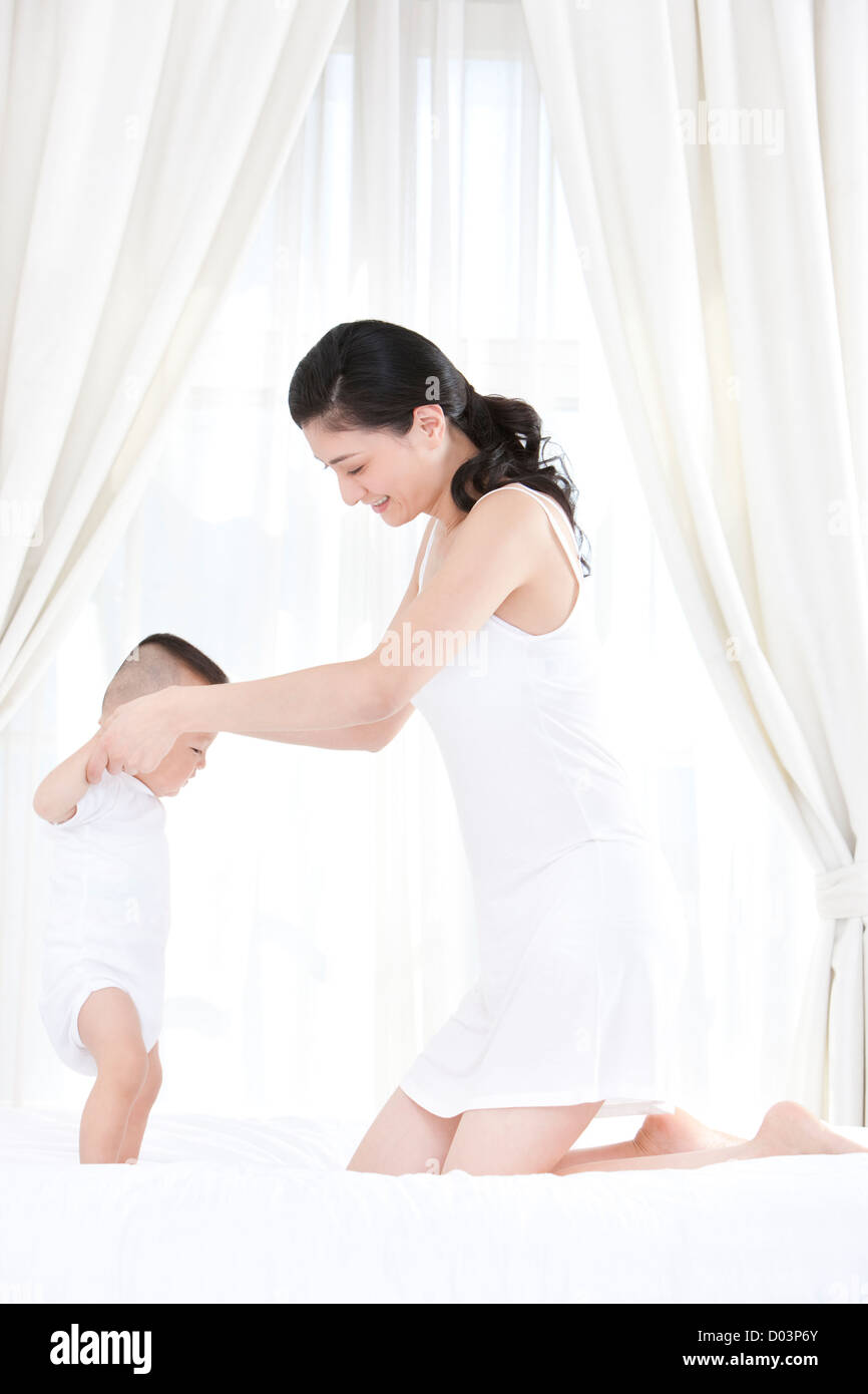 Sweet moment between mother and baby Stock Photo - Alamy