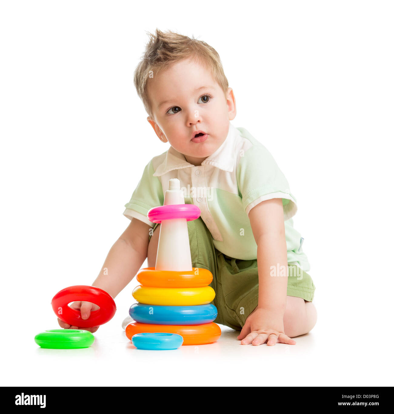 Cute kid playing colorful tower isolated on white Stock Photo - Alamy