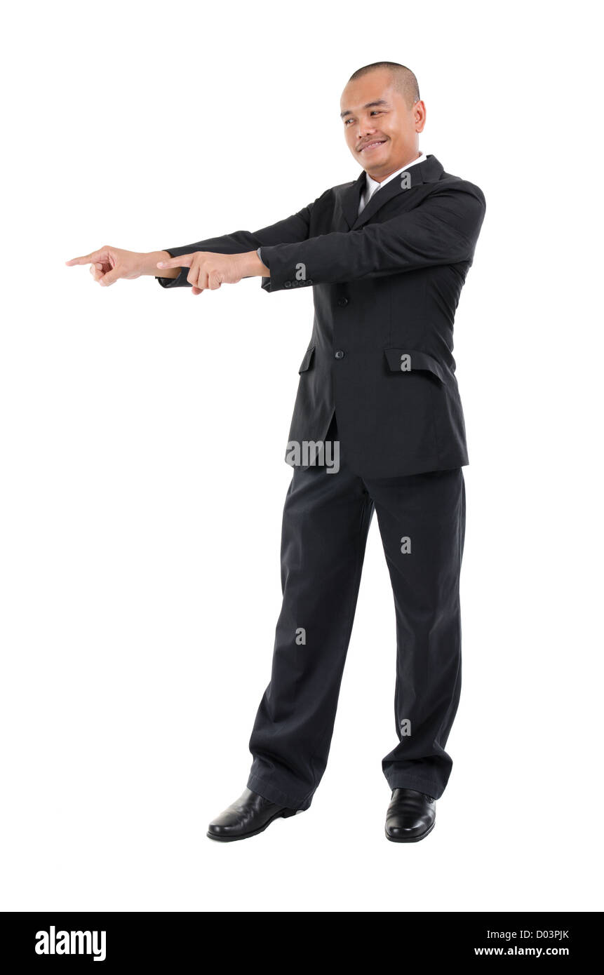 Portrait of a Southeast Asian man showing something on white background ...