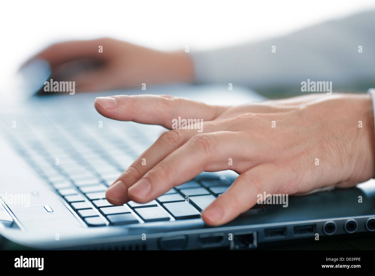 Hands typing on laptop keyboard Stock Photo - Alamy