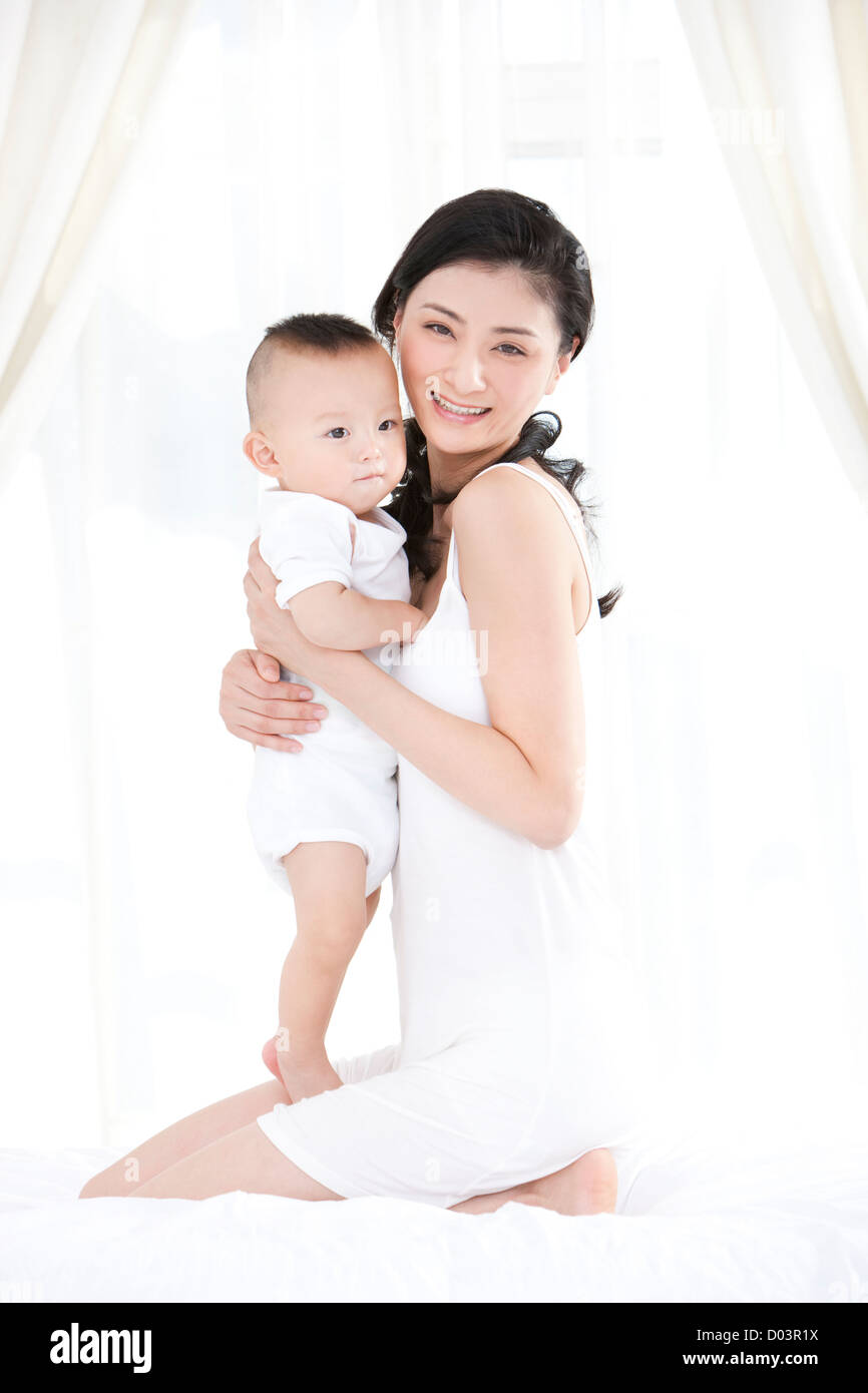 Tender moment between mother and baby Stock Photo - Alamy