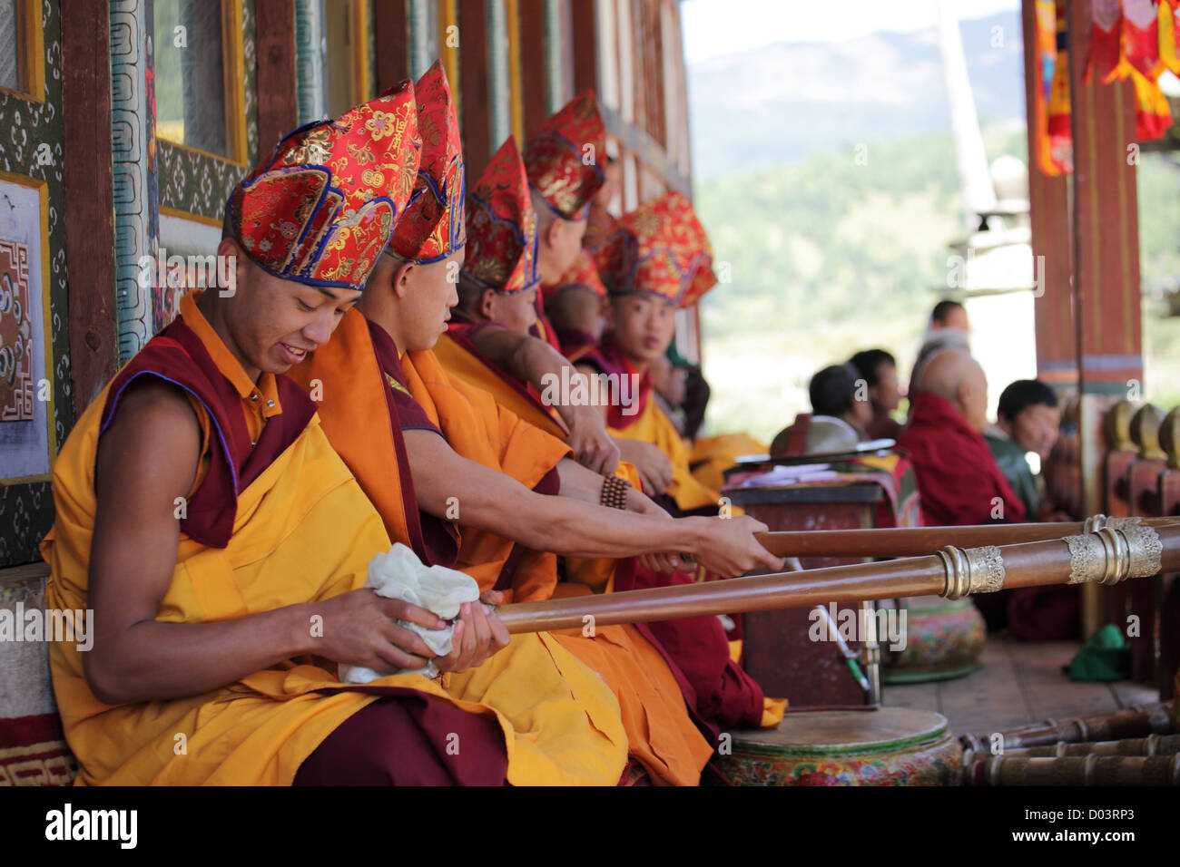 Buddhist monks getting ready to play horns before the festive ceremony ...