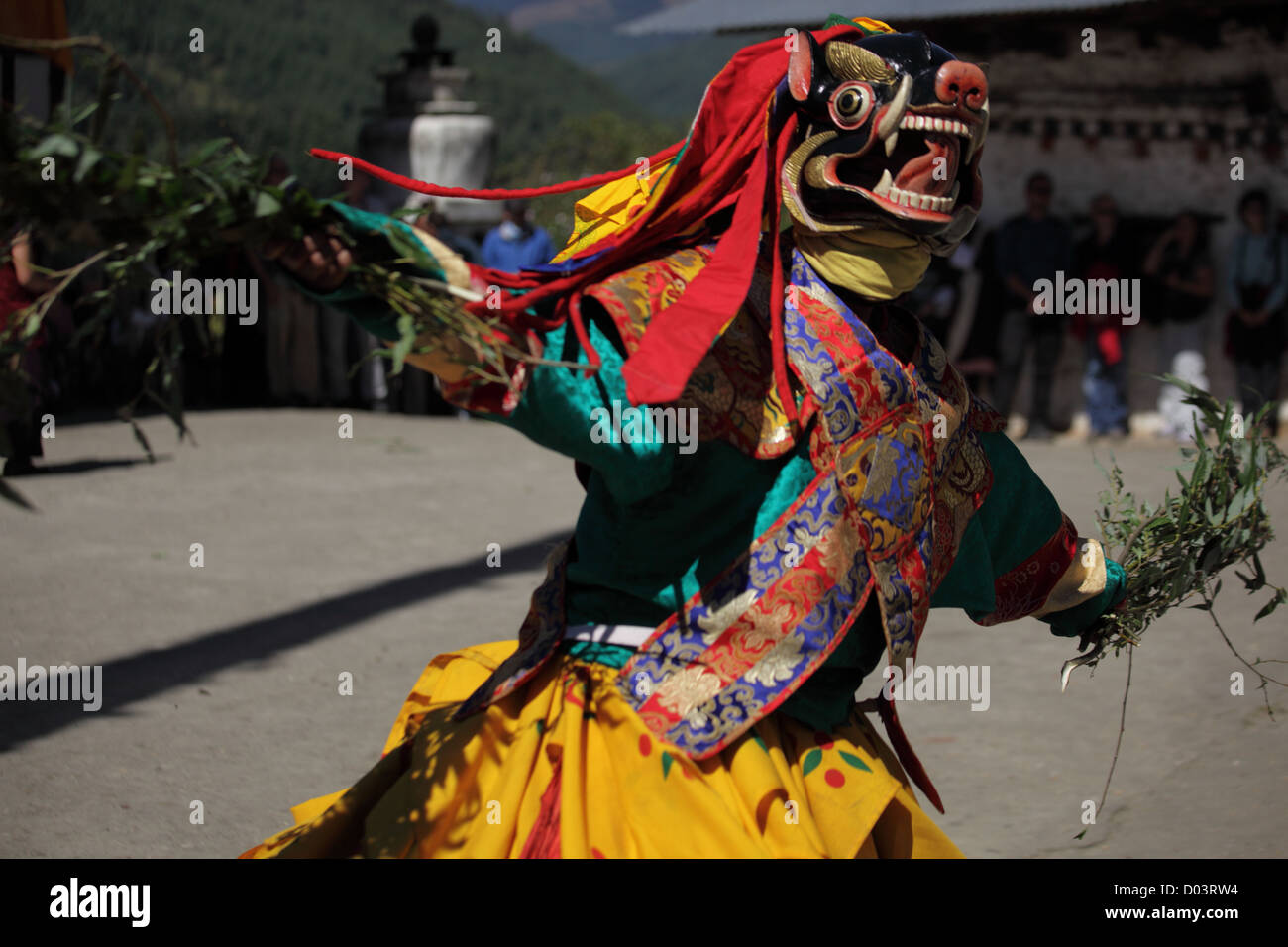 Costumed and masked dancers at a Buddhist religious ceremony Stock ...