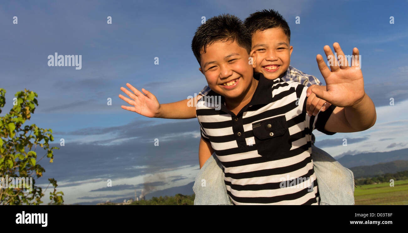 Two sibling happy together Stock Photo - Alamy