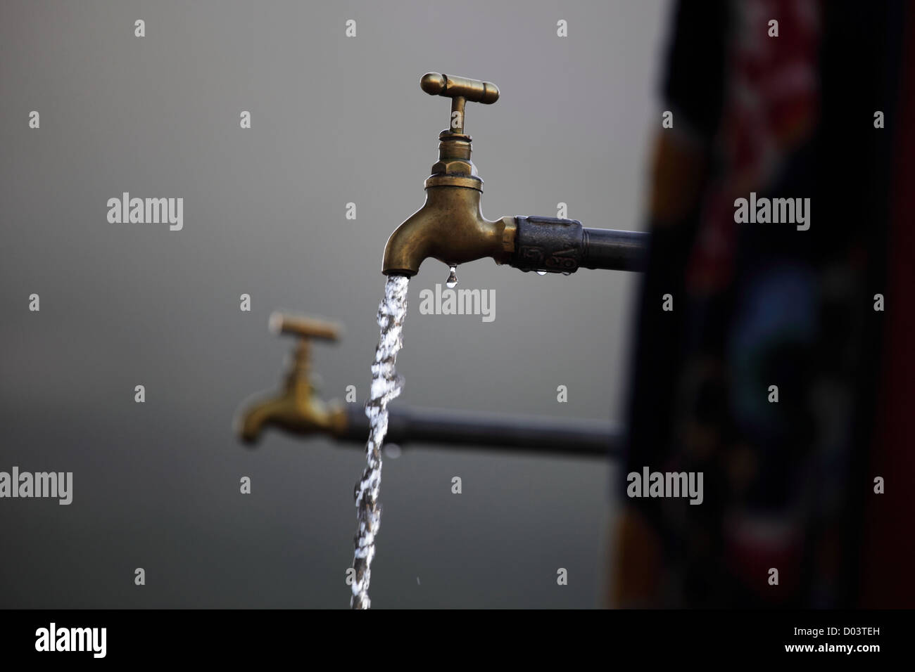 Water flowing from the tap Stock Photo - Alamy