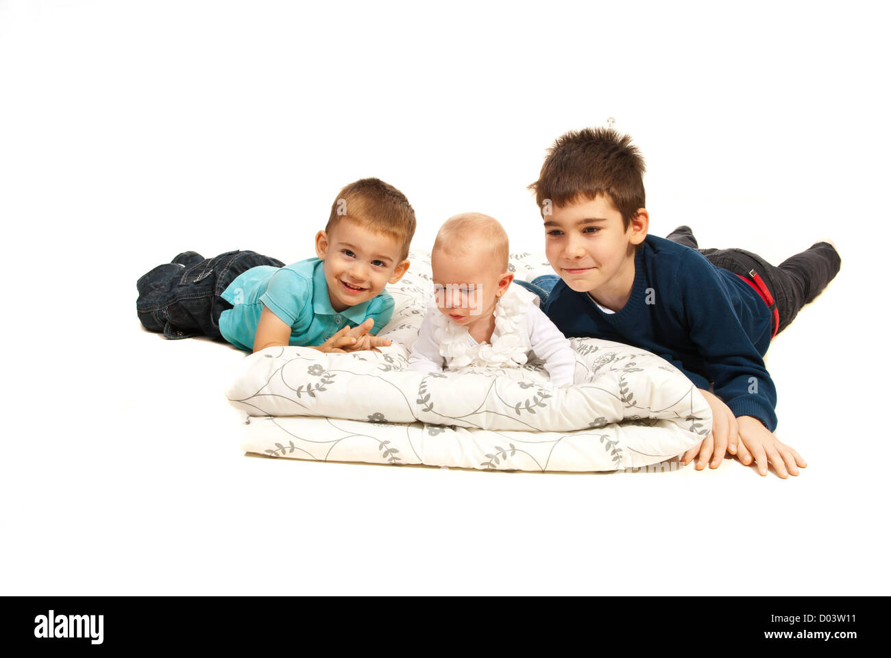 Happy three brothers lying down together isolated on white background ...