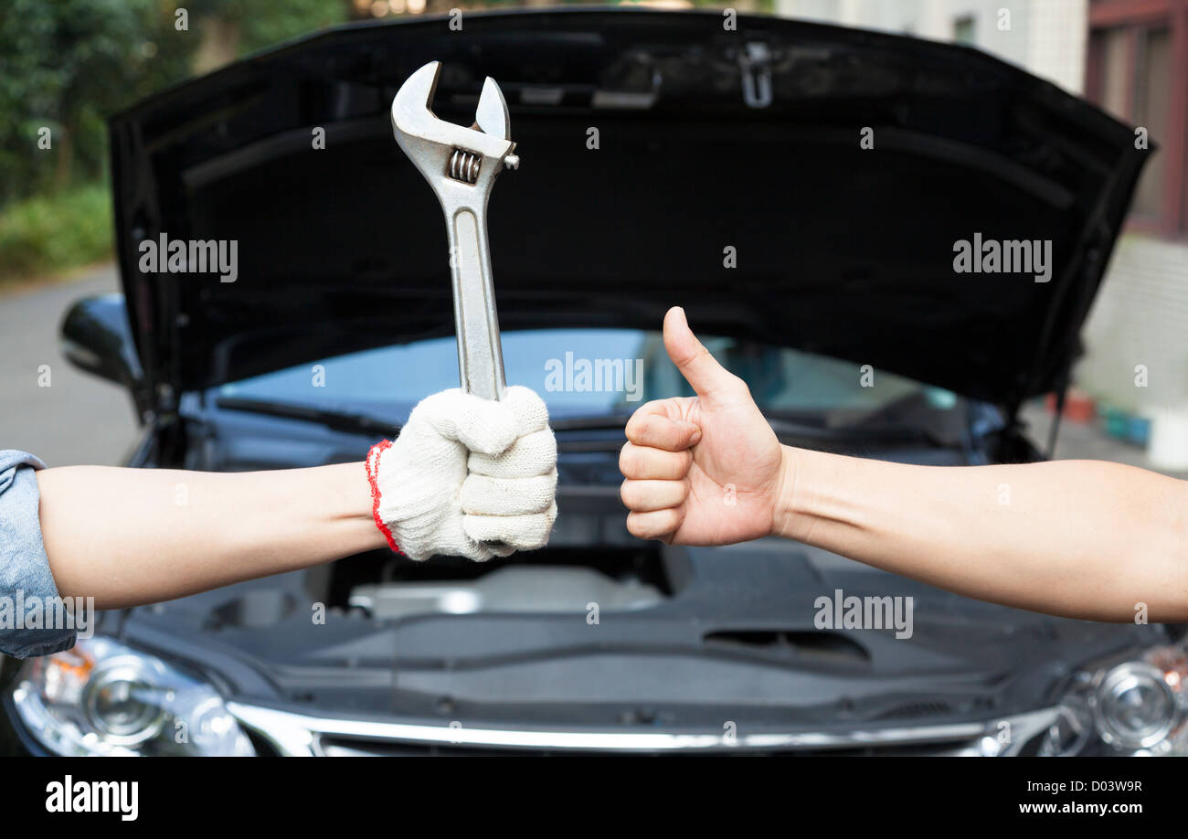 hand of mechanic with thumbs up and tool Stock Photo - Alamy