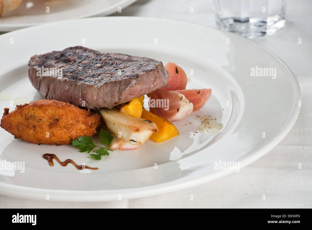 Black Angus beef steak with seasonal vegetables Stock Photo - Alamy