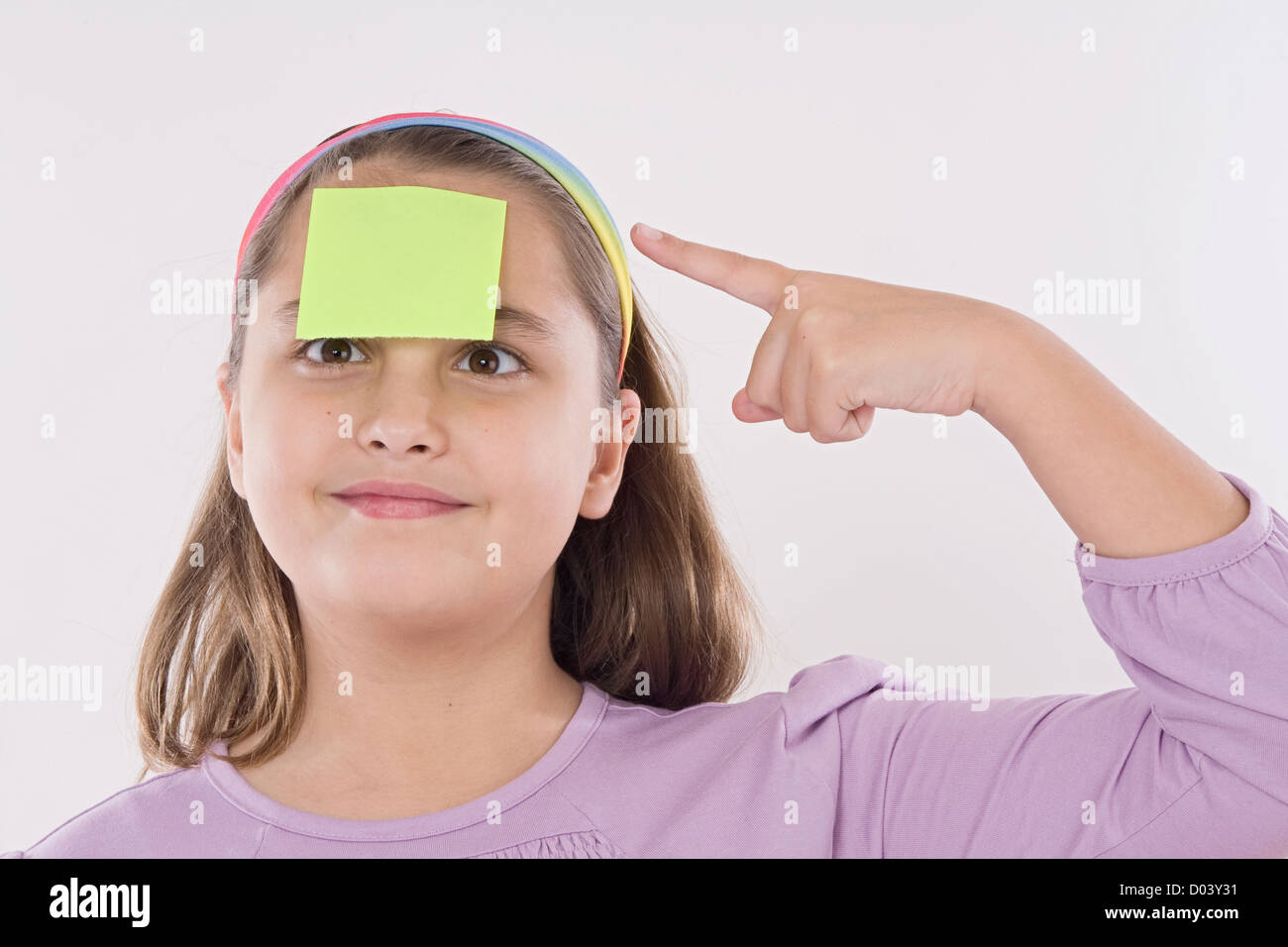 Adorable girl squint with a note in her front Stock Photo - Alamy