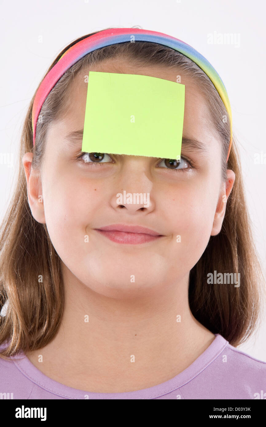 Adorable girl with a note in her front isolated over white Stock Photo ...