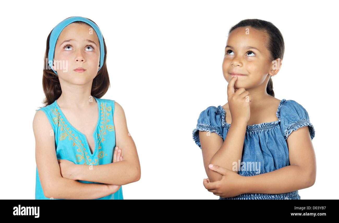 Two little girls thinking on a over white background Stock Photo - Alamy