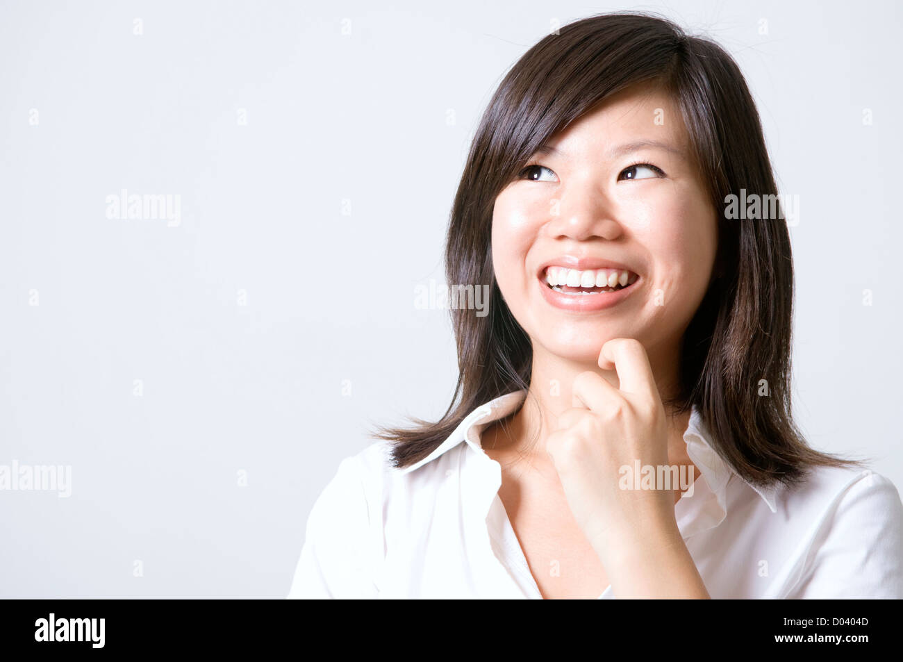 Young women having a thought Stock Photo - Alamy