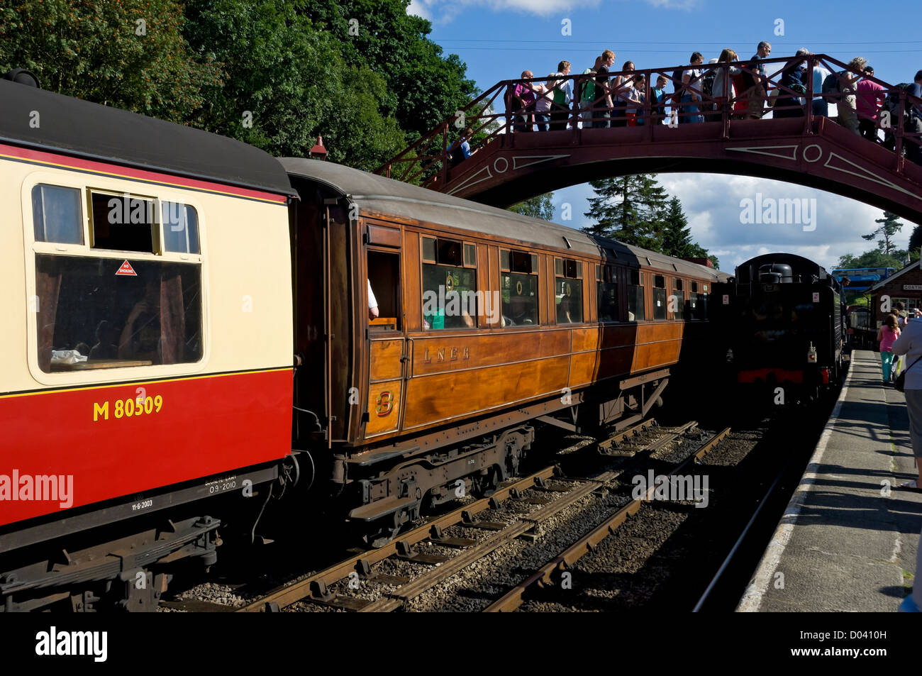 People tourists watching trains train at Goathland Railway Station in ...
