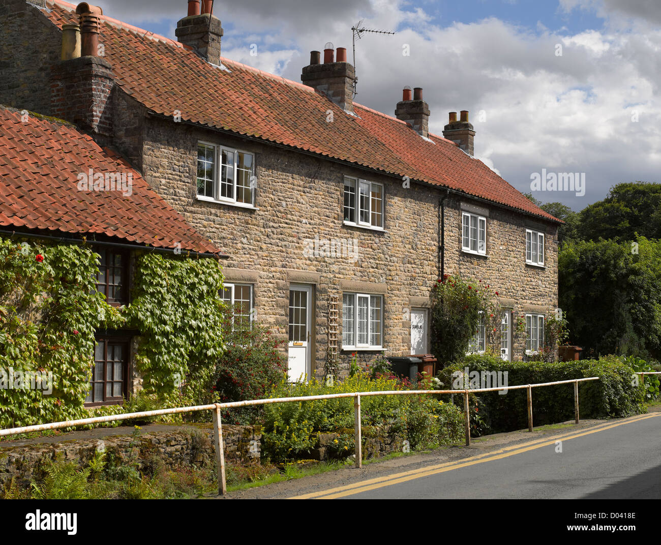 Traditional stone cottages cottage house home on Maltongate in summer ...