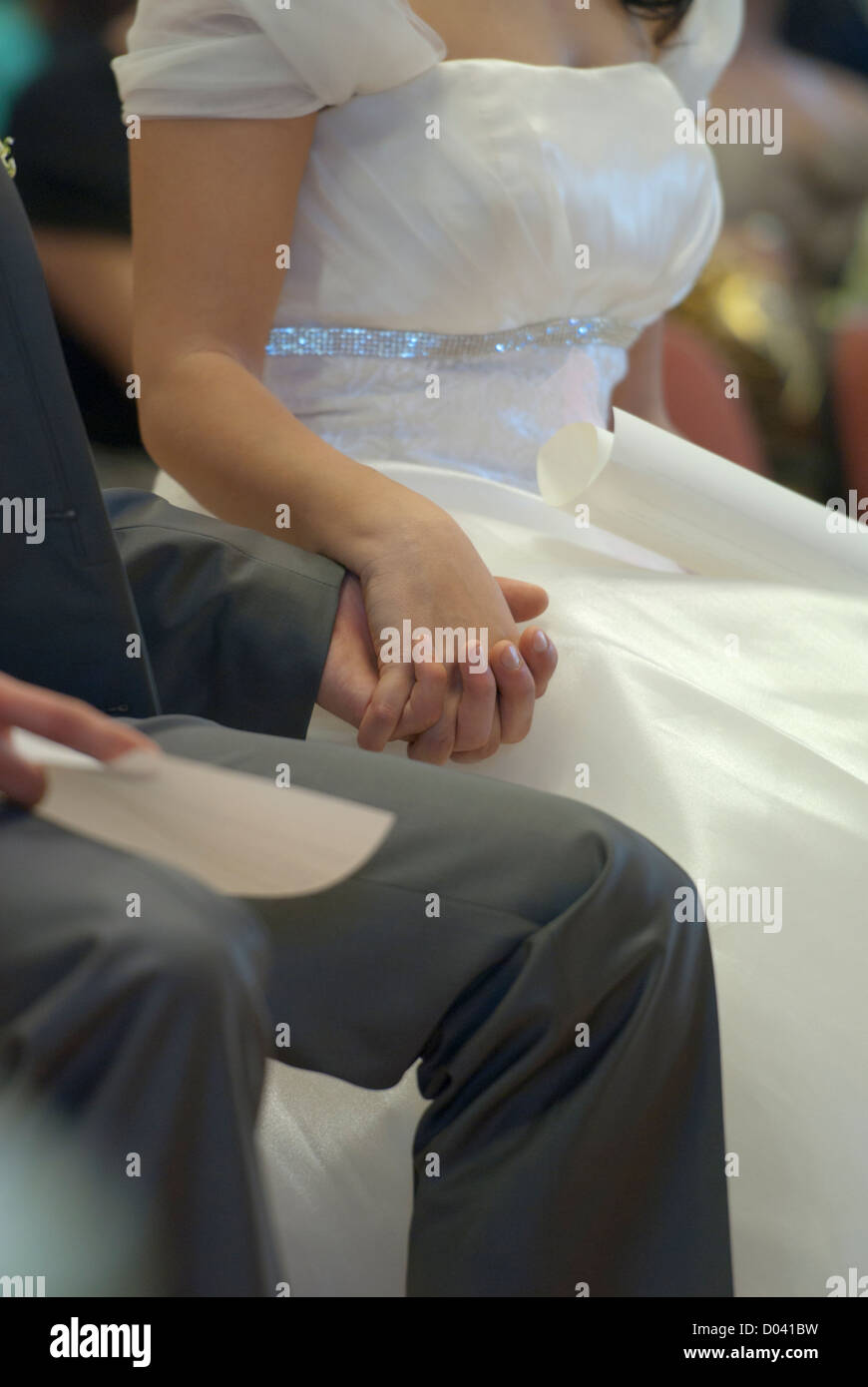Couple joining hands during wedding ceremony, Firenze, Tuscany, Italy ...