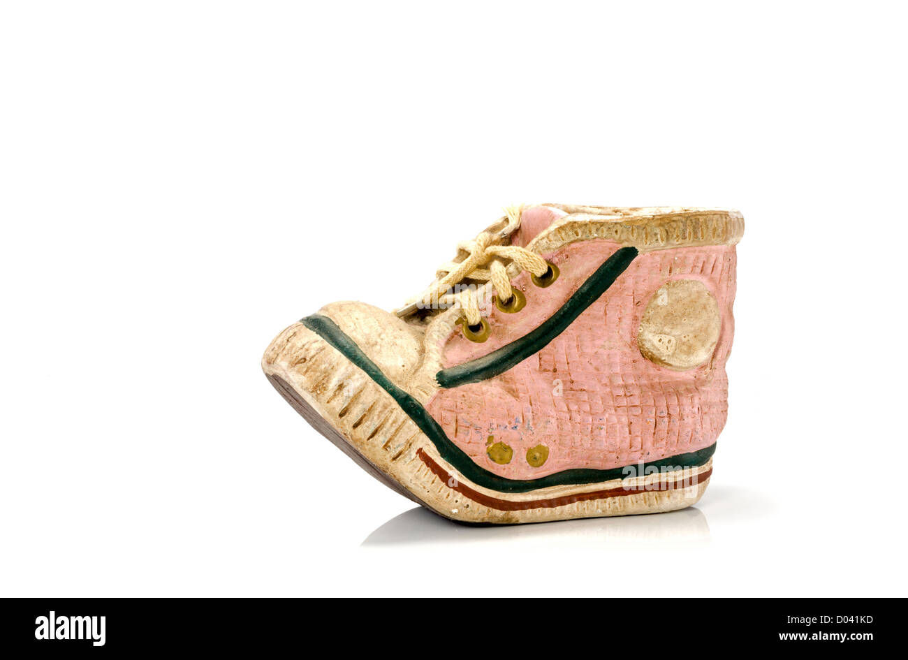 small shoe made from stone isolated on white Stock Photo - Alamy