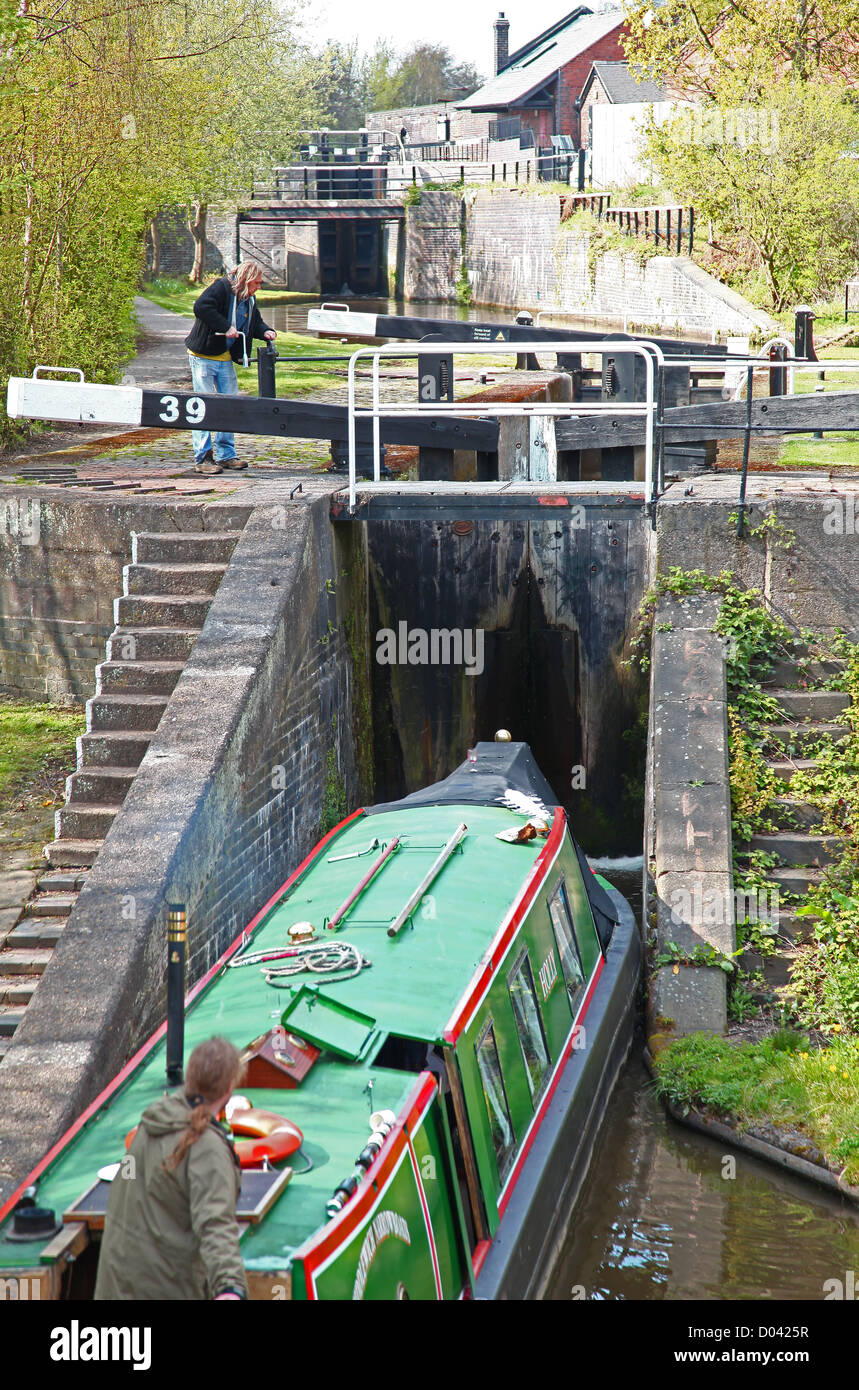 A narrow boat or canal barge entering a lock on the Caldon Canal at ...