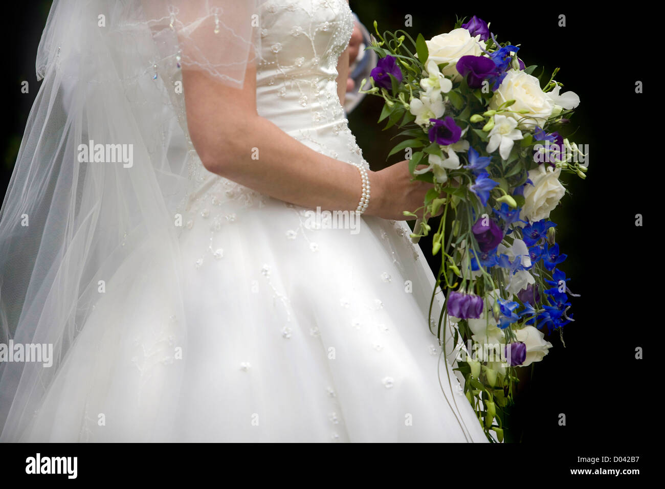 Bride holding her bouquet - Wedding Stock Photo - Alamy