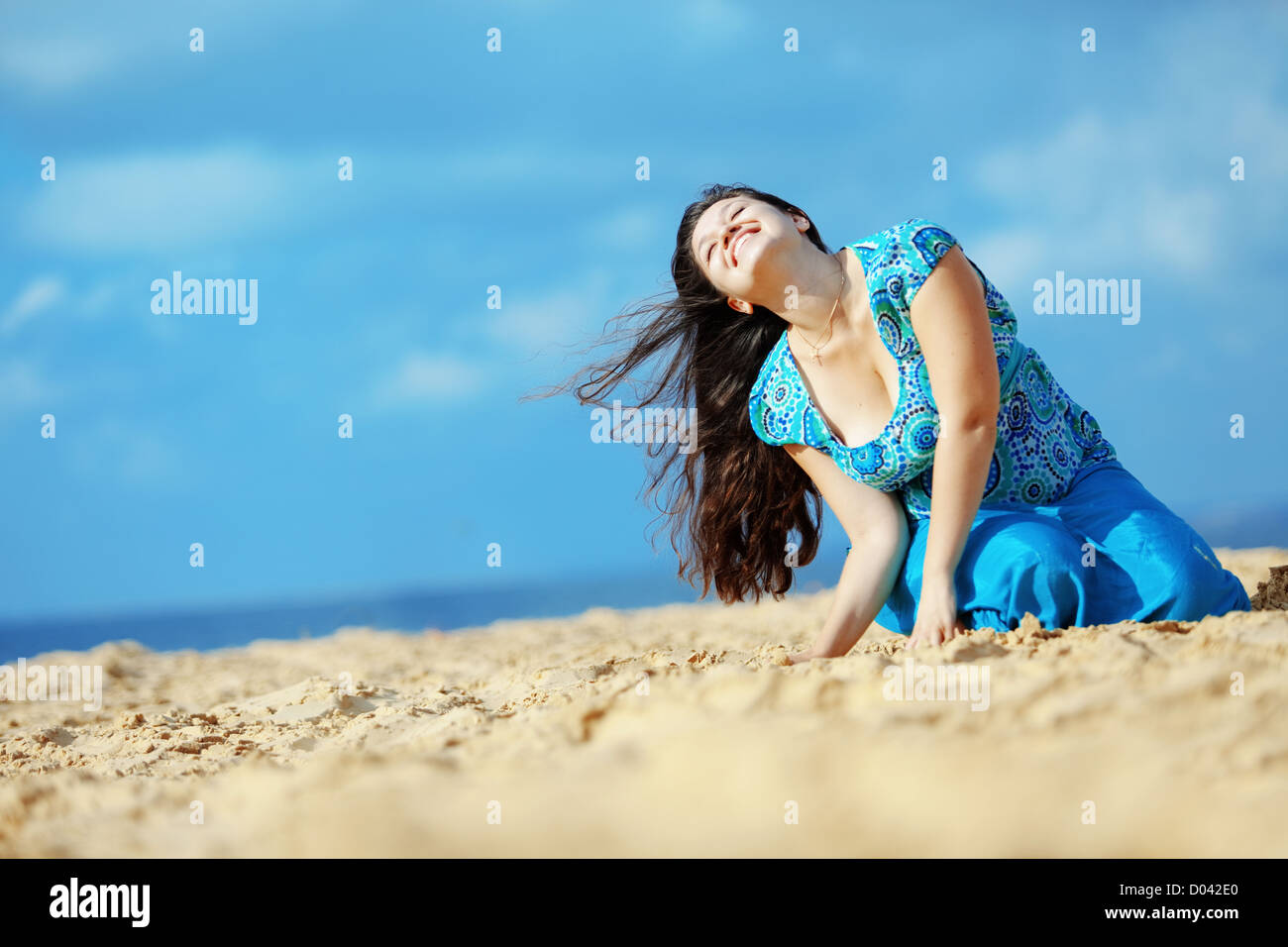 Woman resting at the beach Stock Photo - Alamy