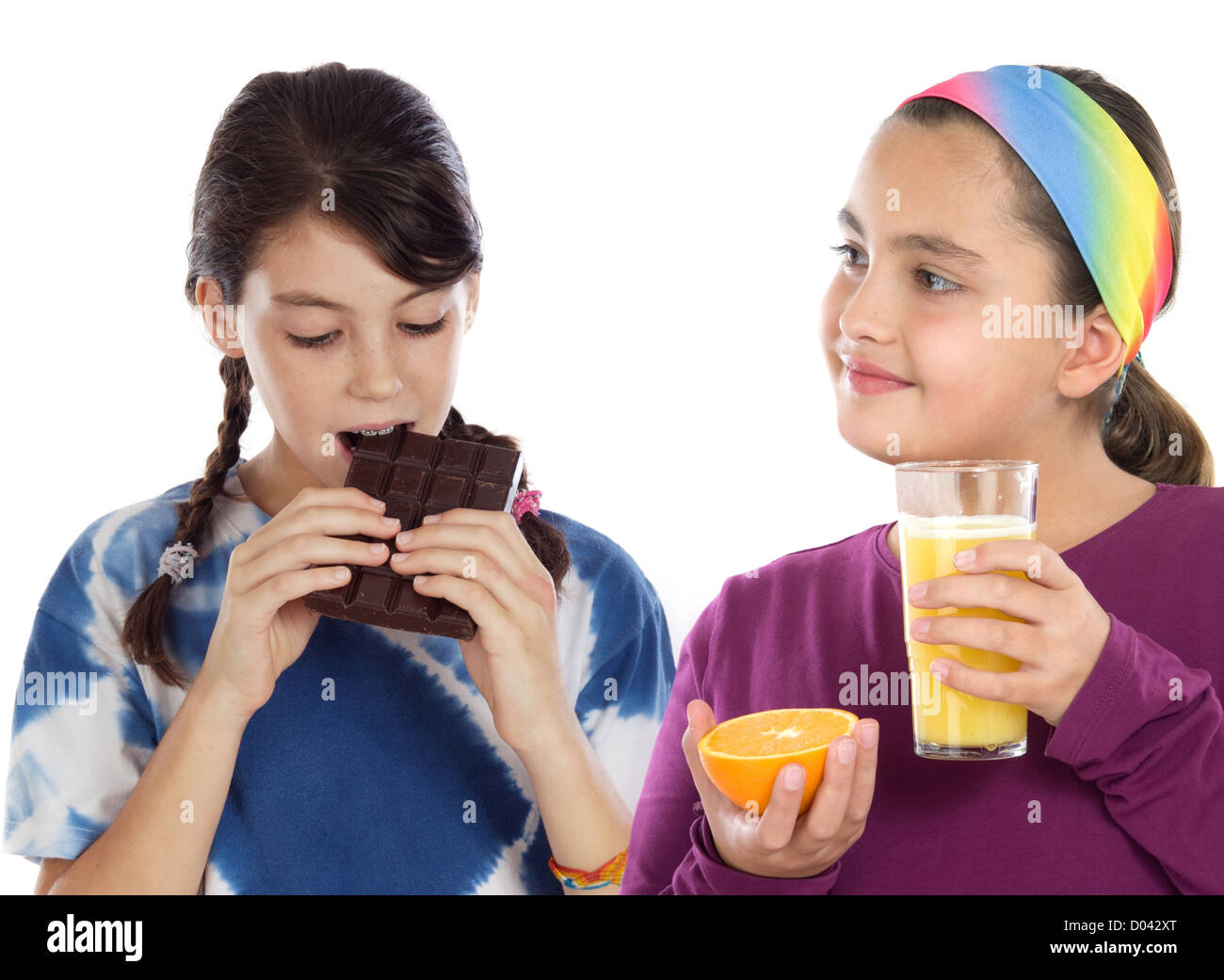 Two beautiful girls eating various food isolated on white Stock Photo ...