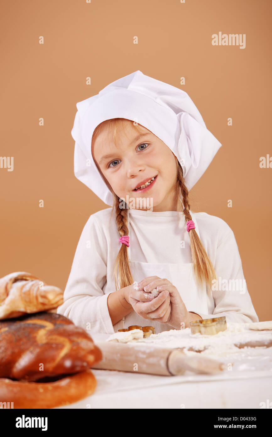 Little cute baker Stock Photo - Alamy