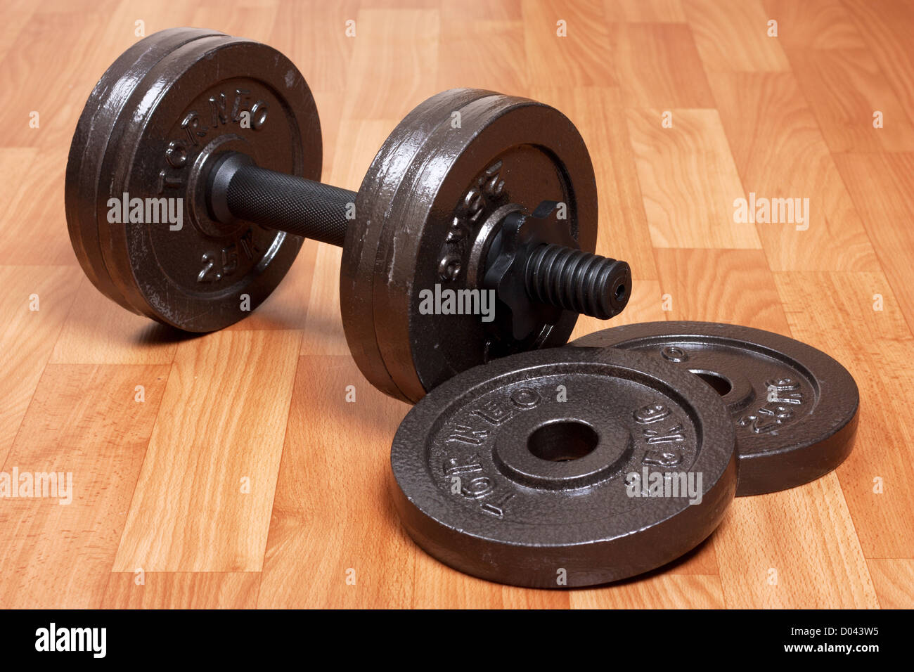 Single heavy dumbbell on a floor Stock Photo - Alamy
