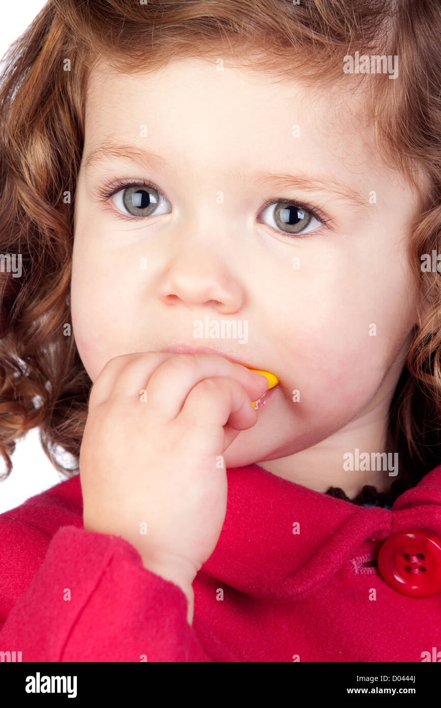 Adorable baby girl eating sweets isolated over white background Stock ...
