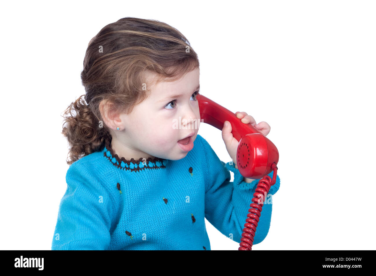 Beautiful baby girl with a red telephone isolated over white background ...