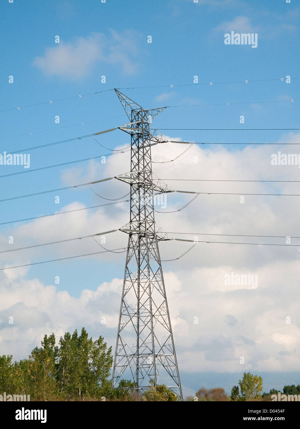 Power lines under a pretty blue sky Stock Photo - Alamy