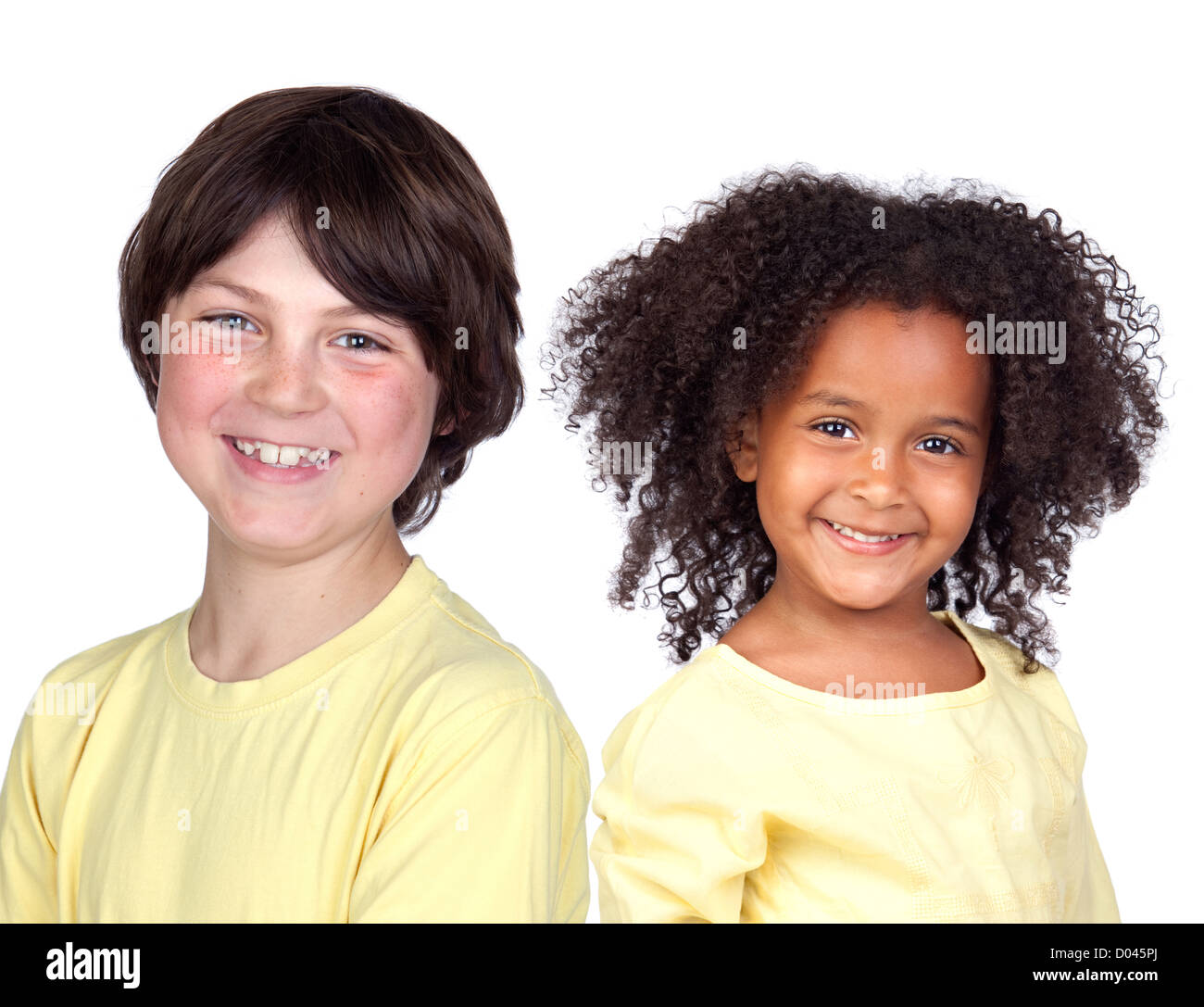 Two beautiful children in yellow isolated on a over white background ...