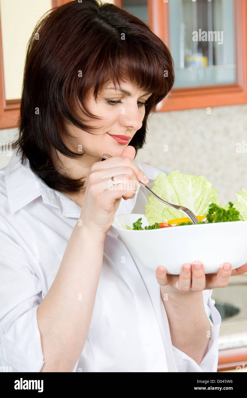 Beautiful a woman to taste cooked the food Stock Photo - Alamy