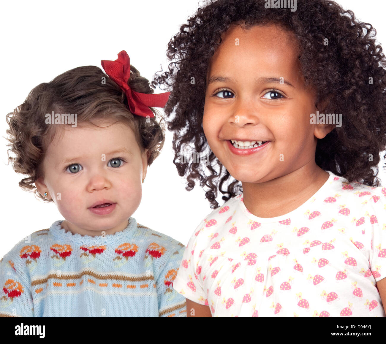Two beautiful baby girls of different races isolated on white ...