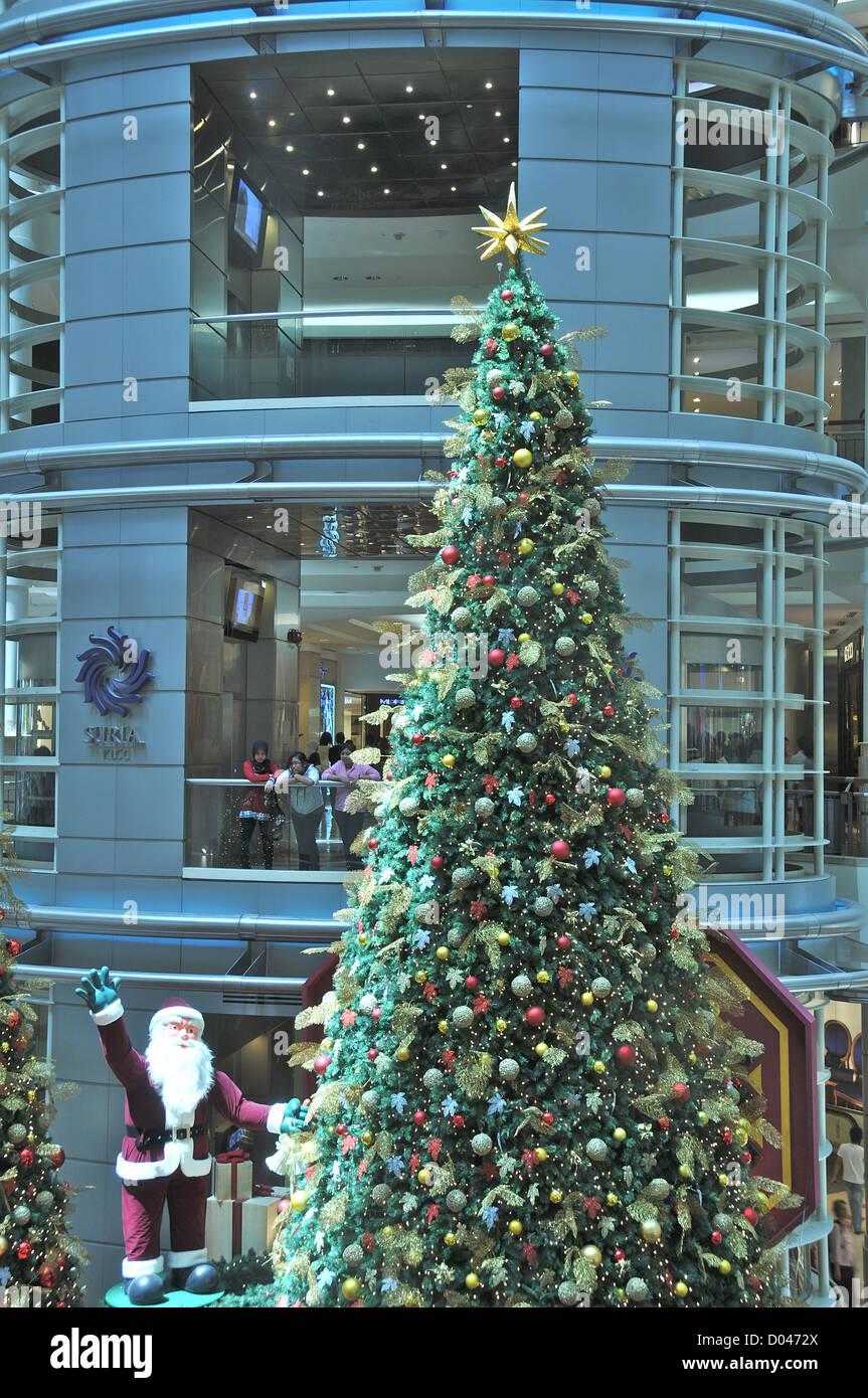 Christmas tree and Santa Claus in hall of Suria KLCC shopping center ...