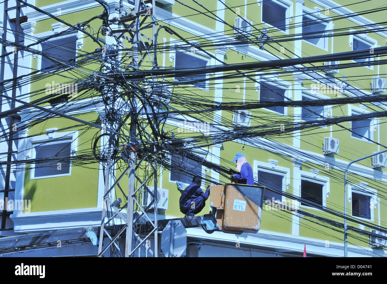 men working on phone lines Vientiane Laos Stock Photo - Alamy