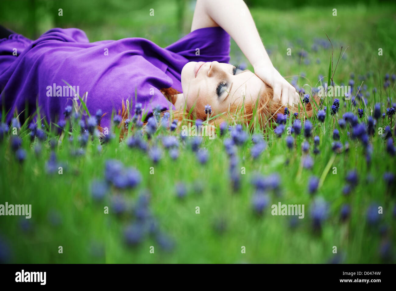 Young cute girl resting in fresh grass Stock Photo - Alamy